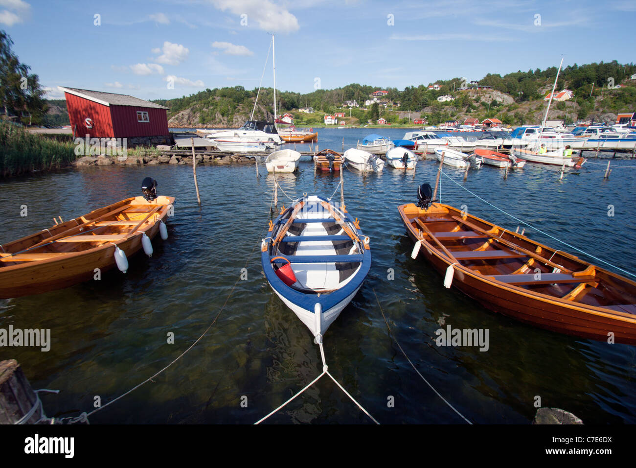 Small boats on a lake in Sweden Stock Photo - Alamy