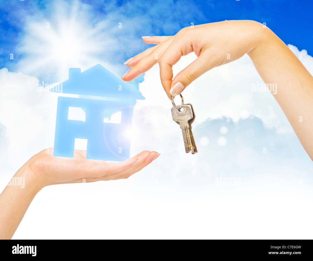 Concept of buying house on blue sky background Stock Photo - Alamy