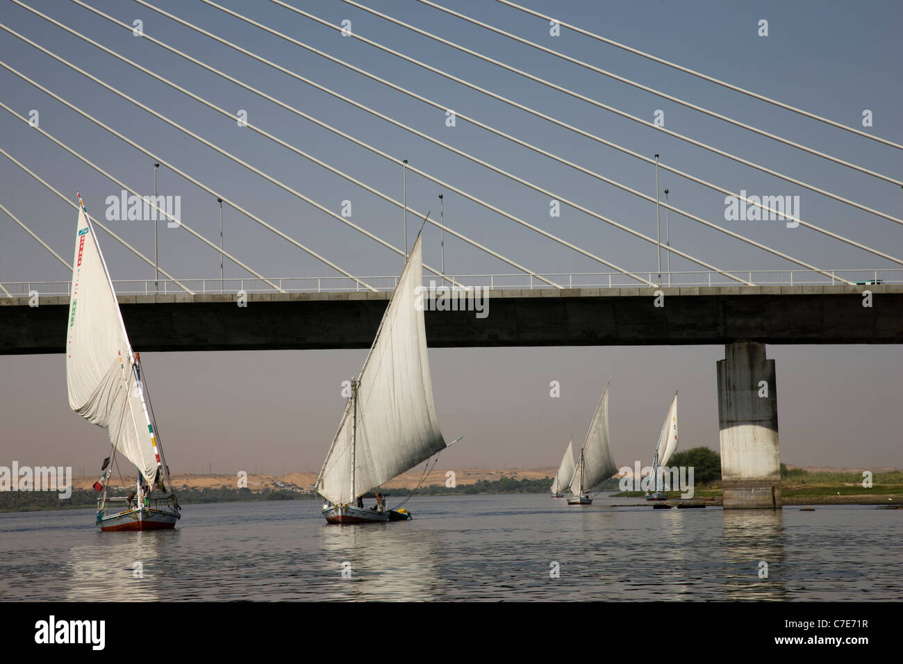 Feluccas and the Aswan suspension bridge across the River Nile Stock ...