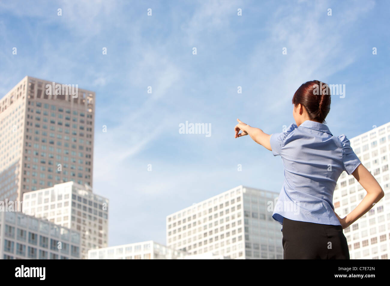 Woman pointing down on city hi-res stock photography and images - Alamy