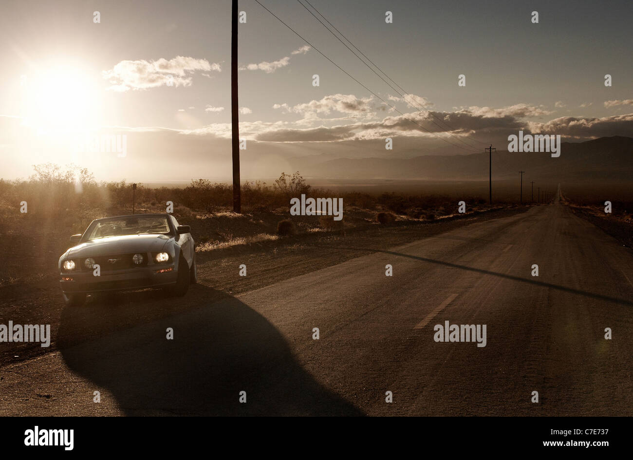 Ford Mustang in desert sunset landscape Mojave Desert California USA ...