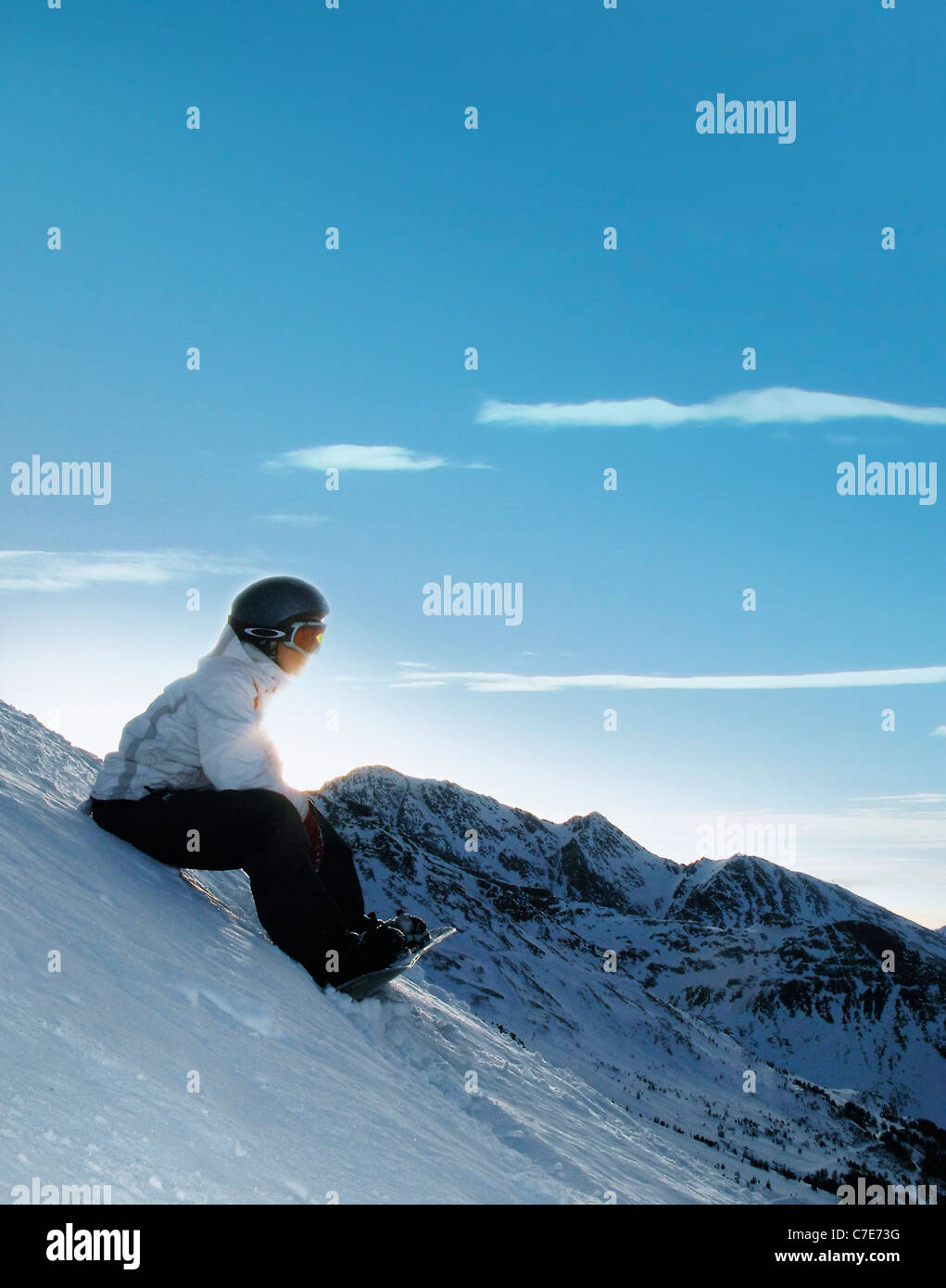 Snow boarder in sat on snow mountains Stock Photo - Alamy