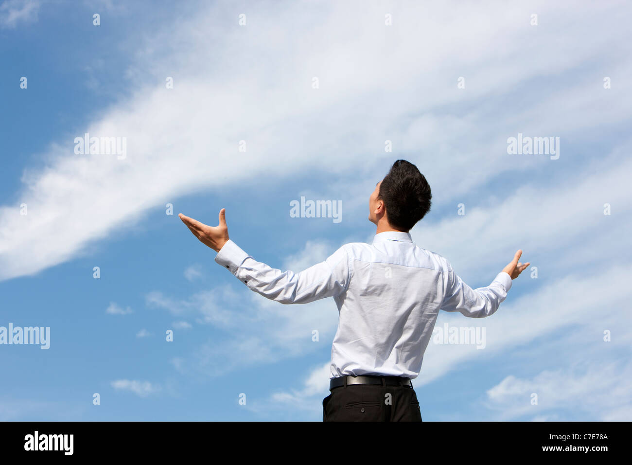 Businessman Standing with Arms Outstretched Stock Photo - Alamy