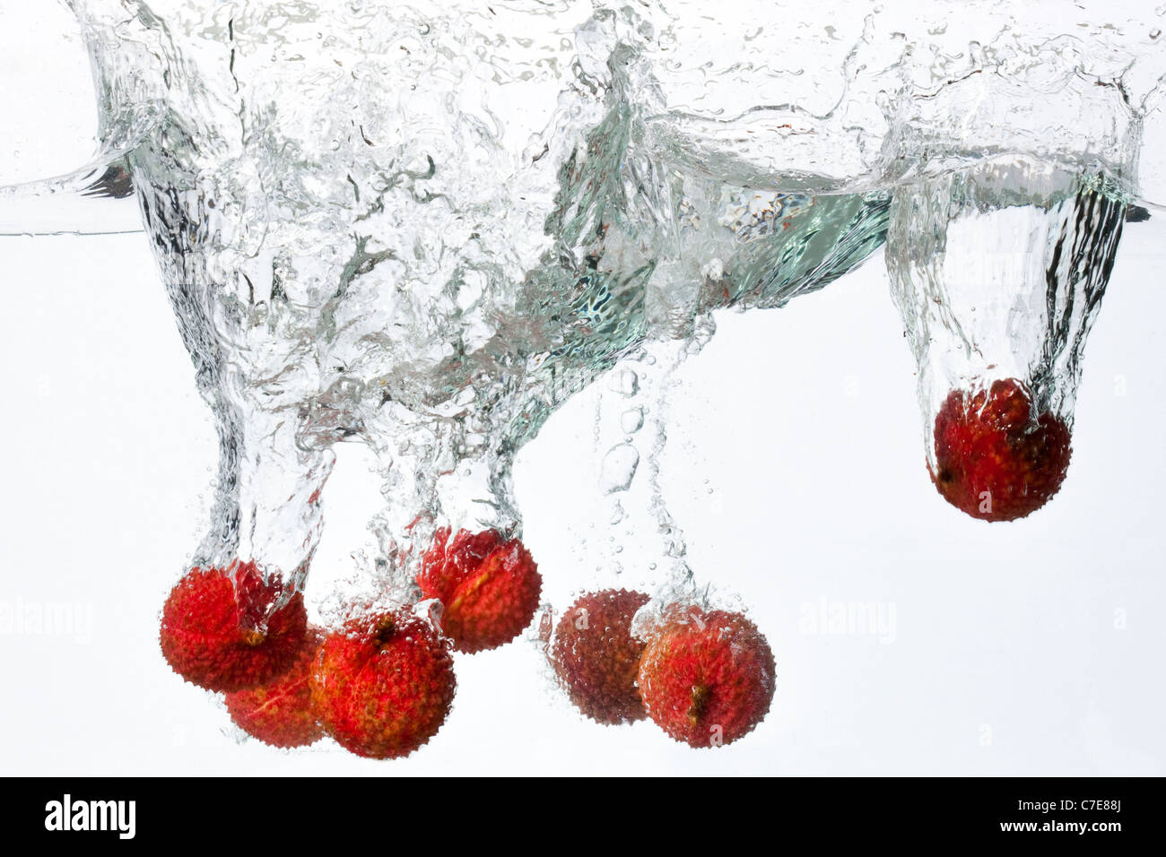 Lychee Splashing into Water Stock Photo - Alamy
