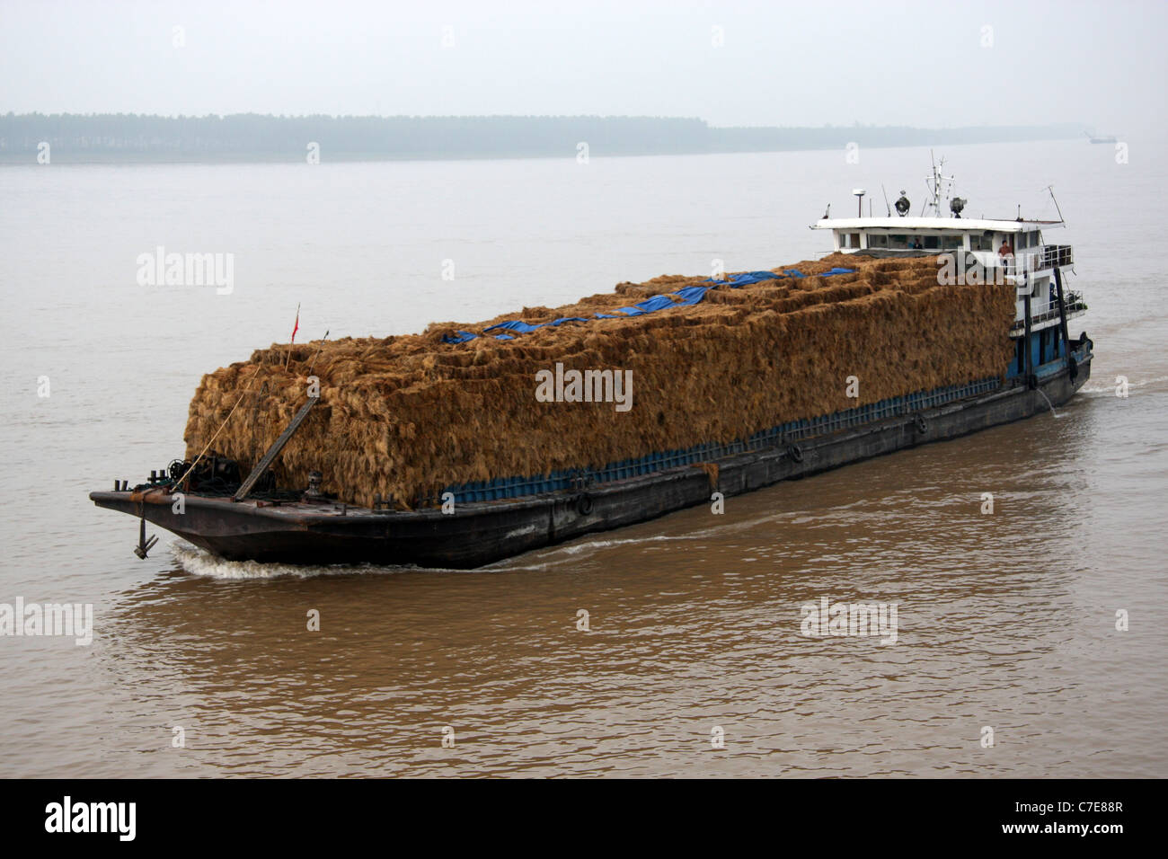 River boat loaded with hay bales, Yangtze River above Jingzhou, China ...