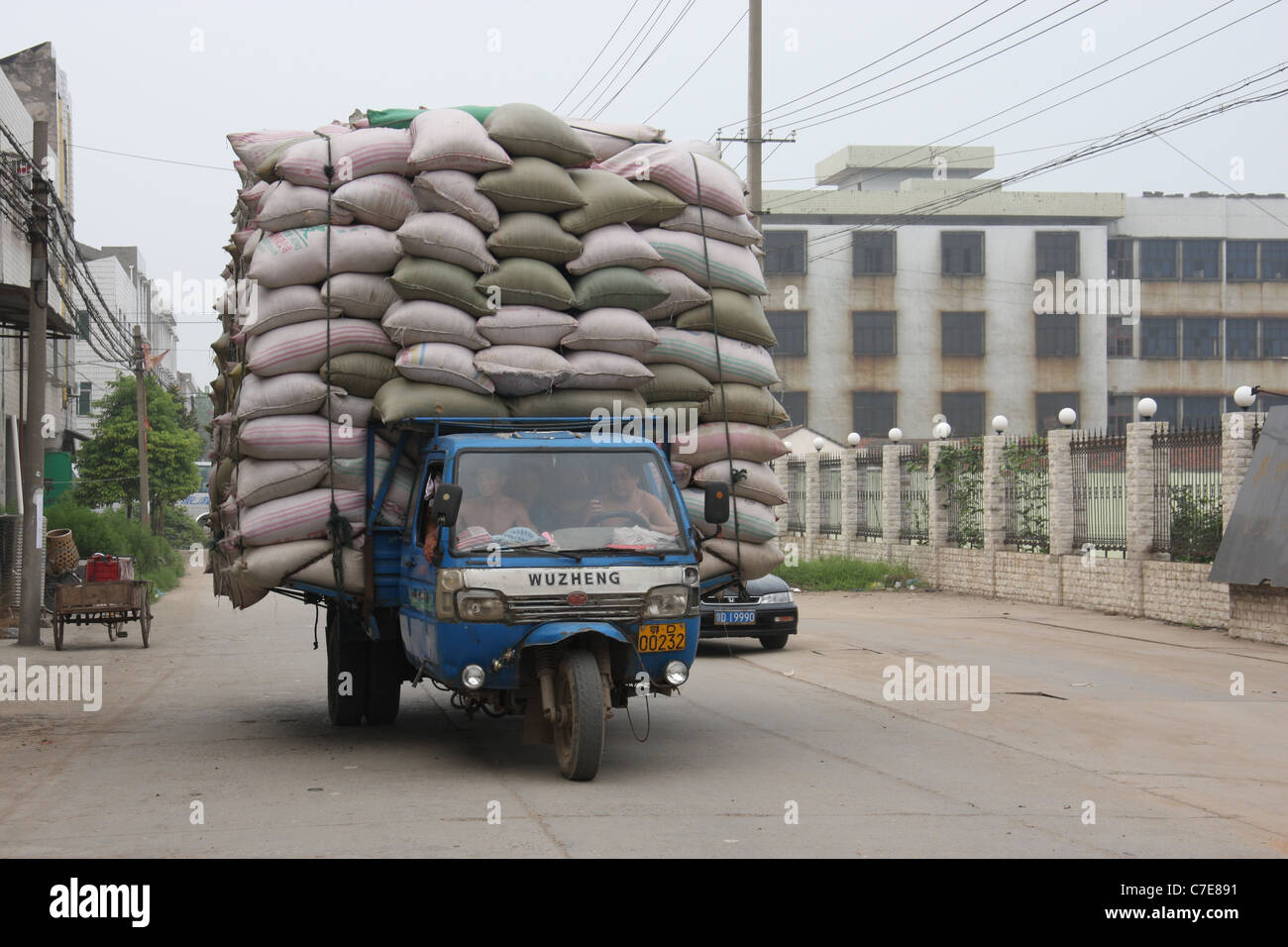 Three wheeled truck with a big load, Jingzhou, China Stock Photo - Alamy