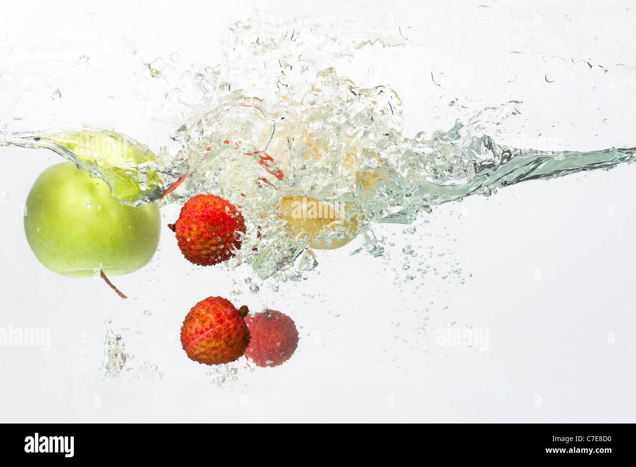 Fruit Splashing in Water Stock Photo - Alamy