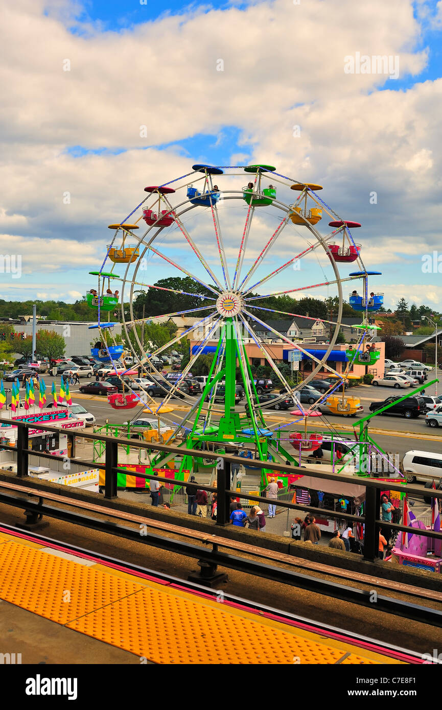 Ferris Wheel carnival rides seen from above, view from LIRR elevated ...