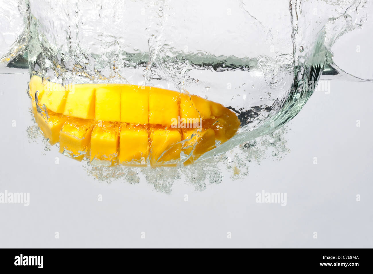 Mango Splashing in Water Stock Photo - Alamy