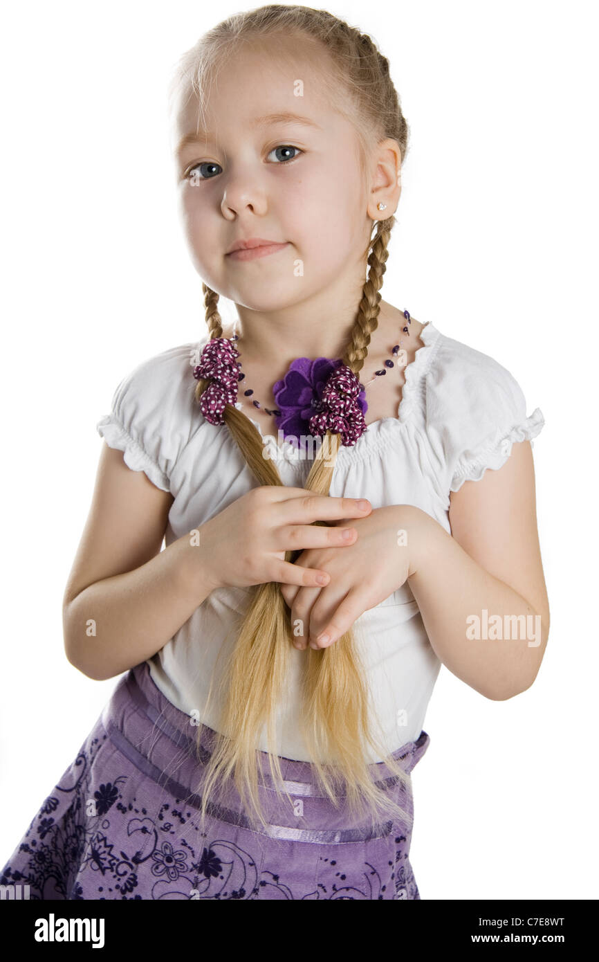 Little girl blonde with long plaits on a white background Stock Photo ...