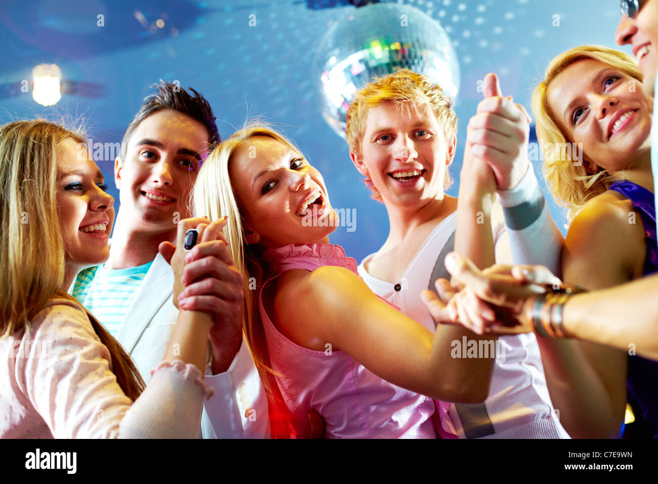 Portrait of three happy couples dancing at party Stock Photo - Alamy