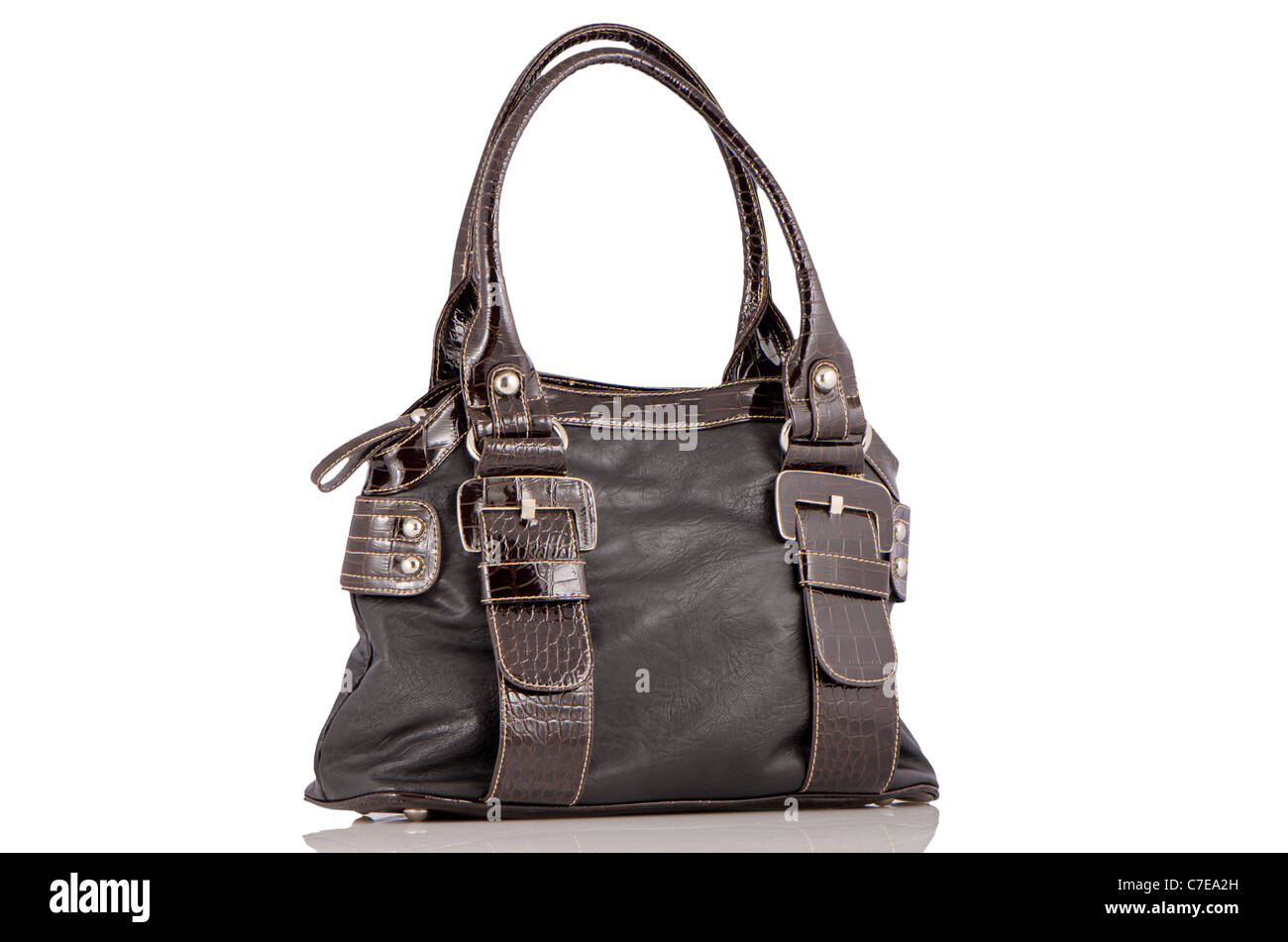Brown woman bag on white reflective background Stock Photo - Alamy