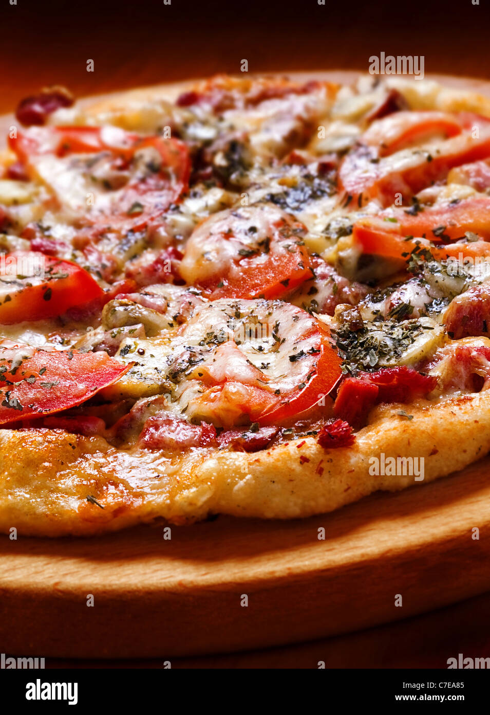Pizza fast food with tomato and cheese closeup Stock Photo - Alamy