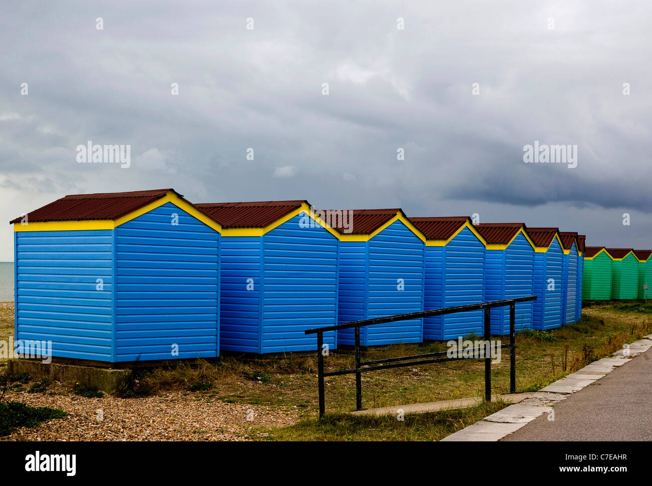 Beach Huts with Storm Clouds Behind Them Stock Photo - Alamy