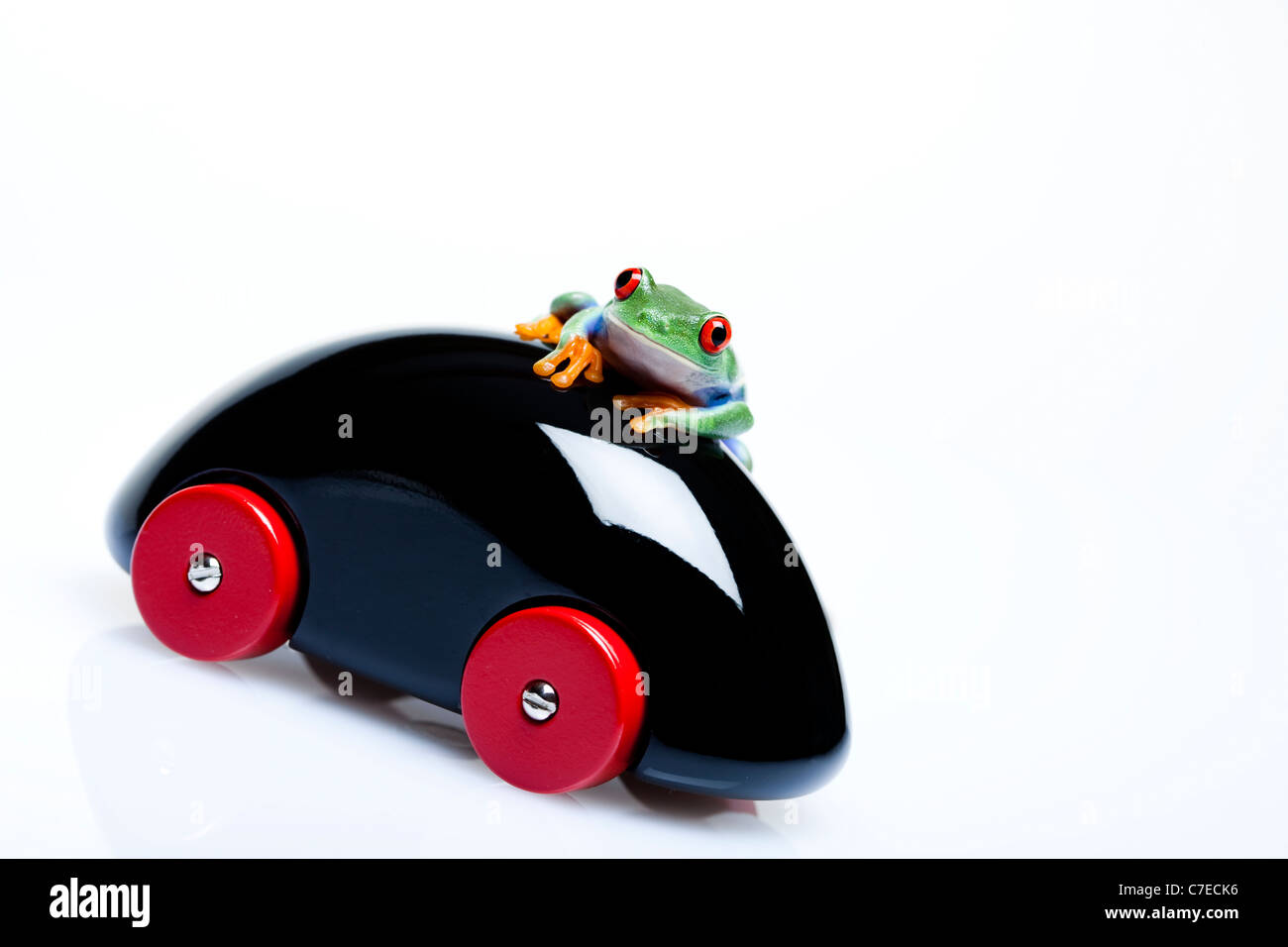 Toy car and frog Stock Photo - Alamy