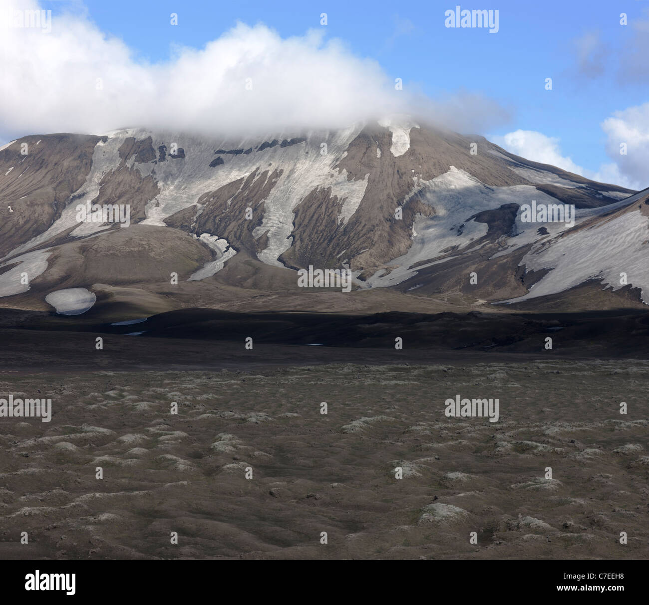 Mountain scenery near the mt. Hekla, lava and snow covered in volcanic ...