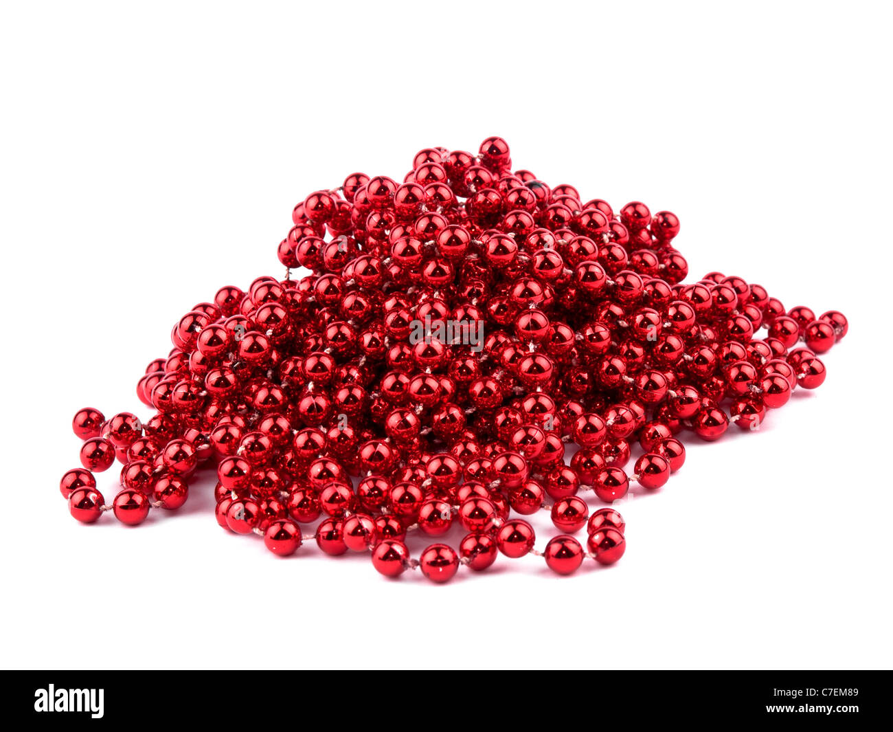 Christmas garland made from small red beads, on white background Stock ...