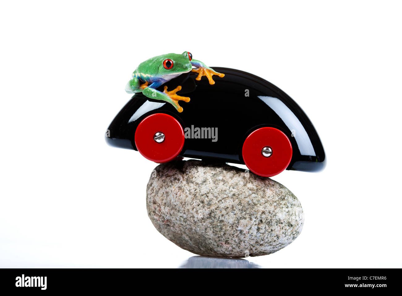Car toy and crazy frog Stock Photo - Alamy
