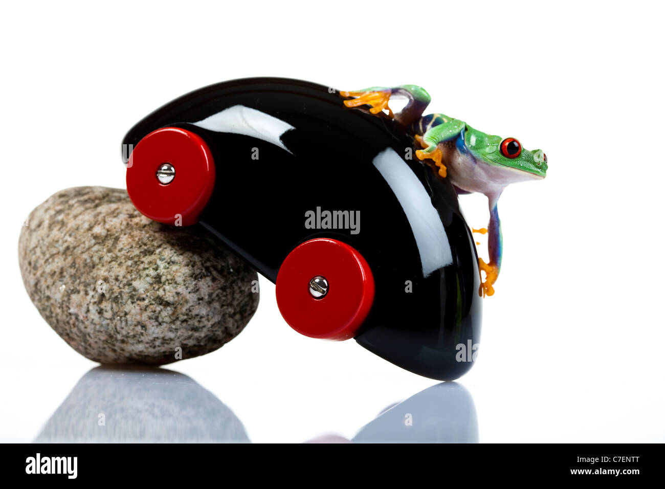 Car toy and crazy frog Stock Photo - Alamy