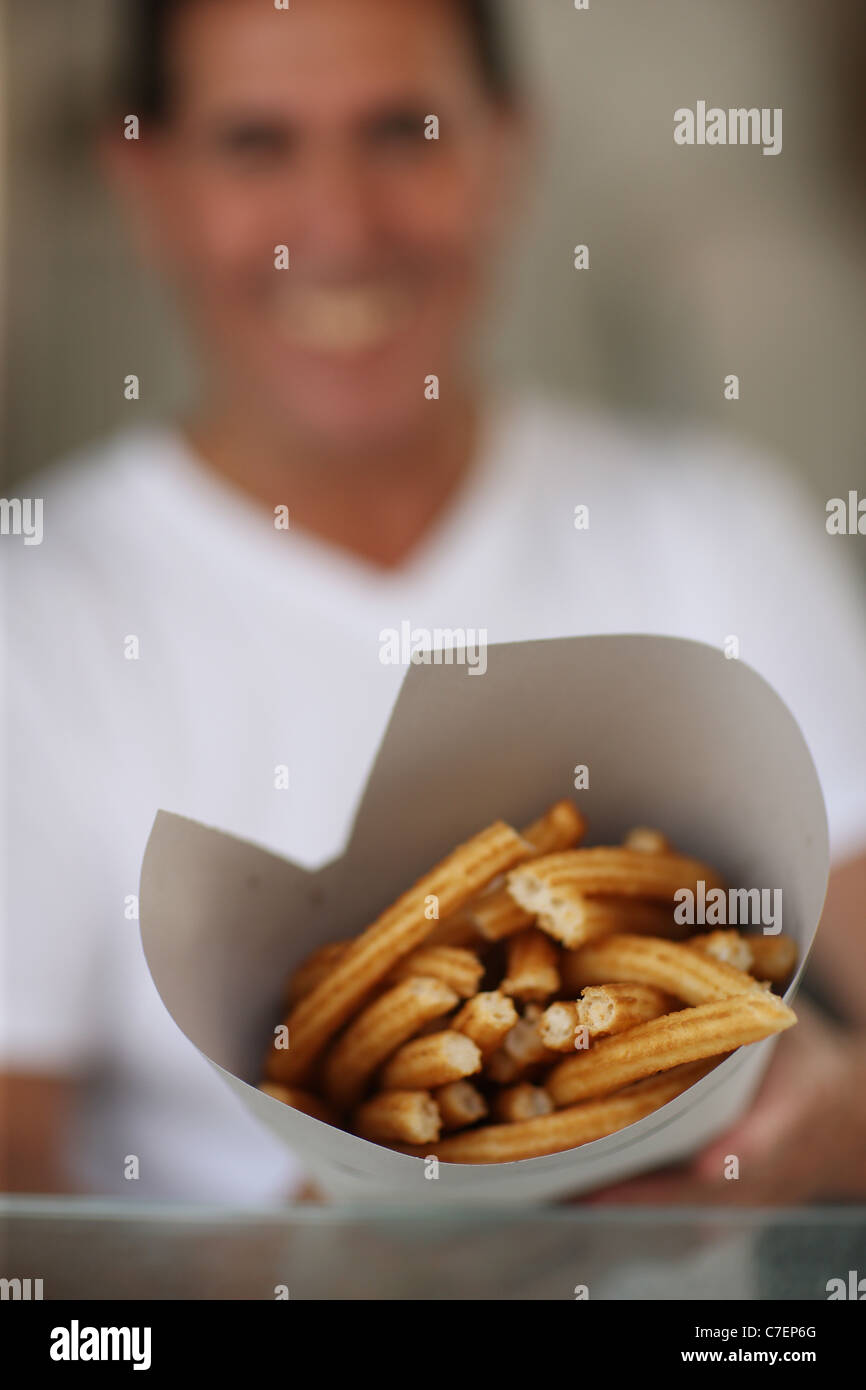 Pictured is a local churros maker at the churros makerin Jerez Stock ...
