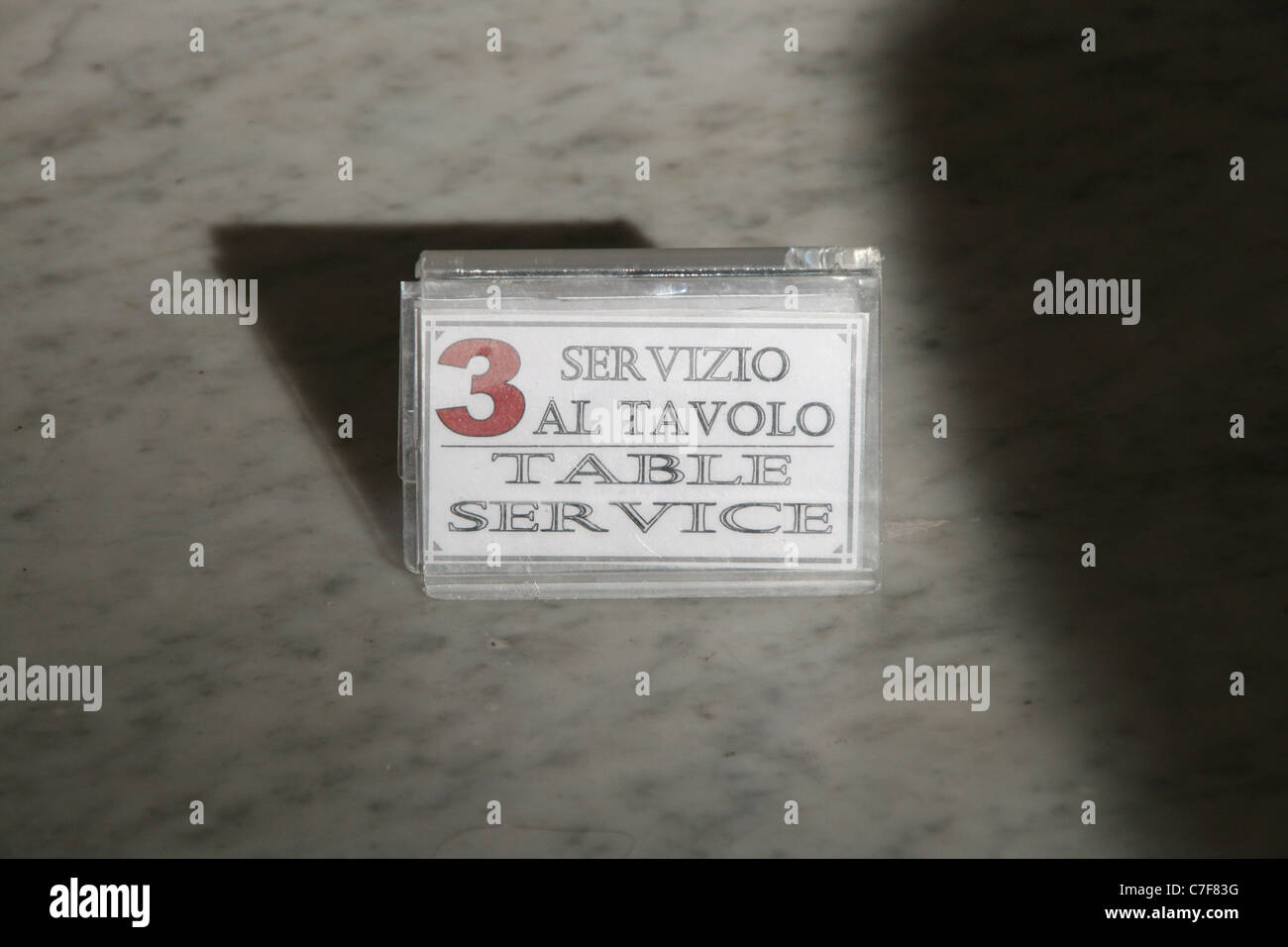 table service sign notice message on cafe bar restaurant table outdoors ...