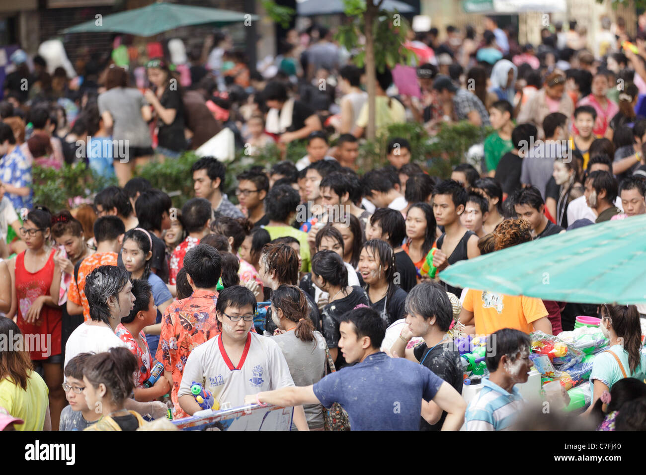 Thai people crowd celebrating song kran buddhist new year in silom road ...