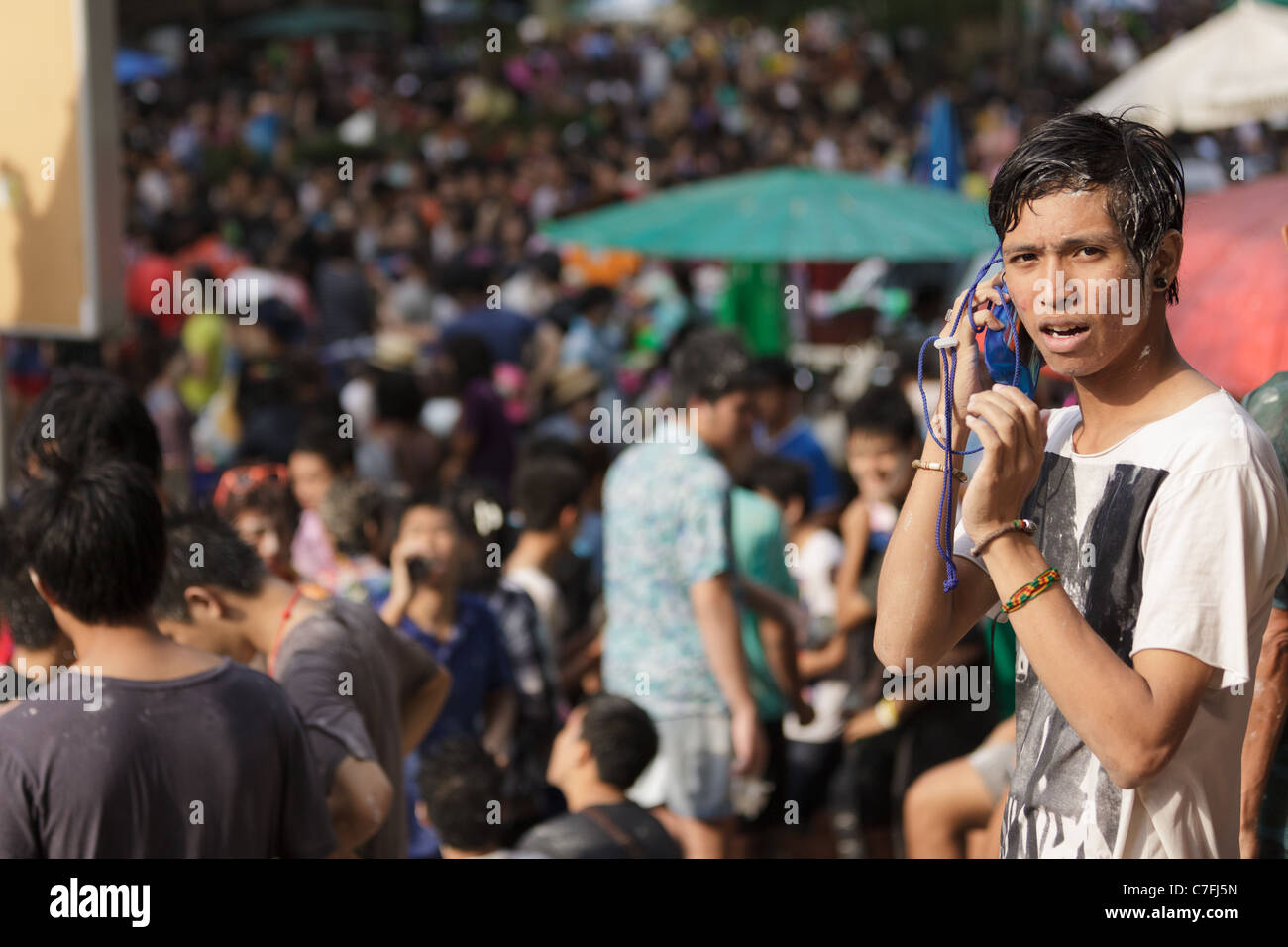 Thai people crowd celebrating song kran buddhist new year in silom road ...