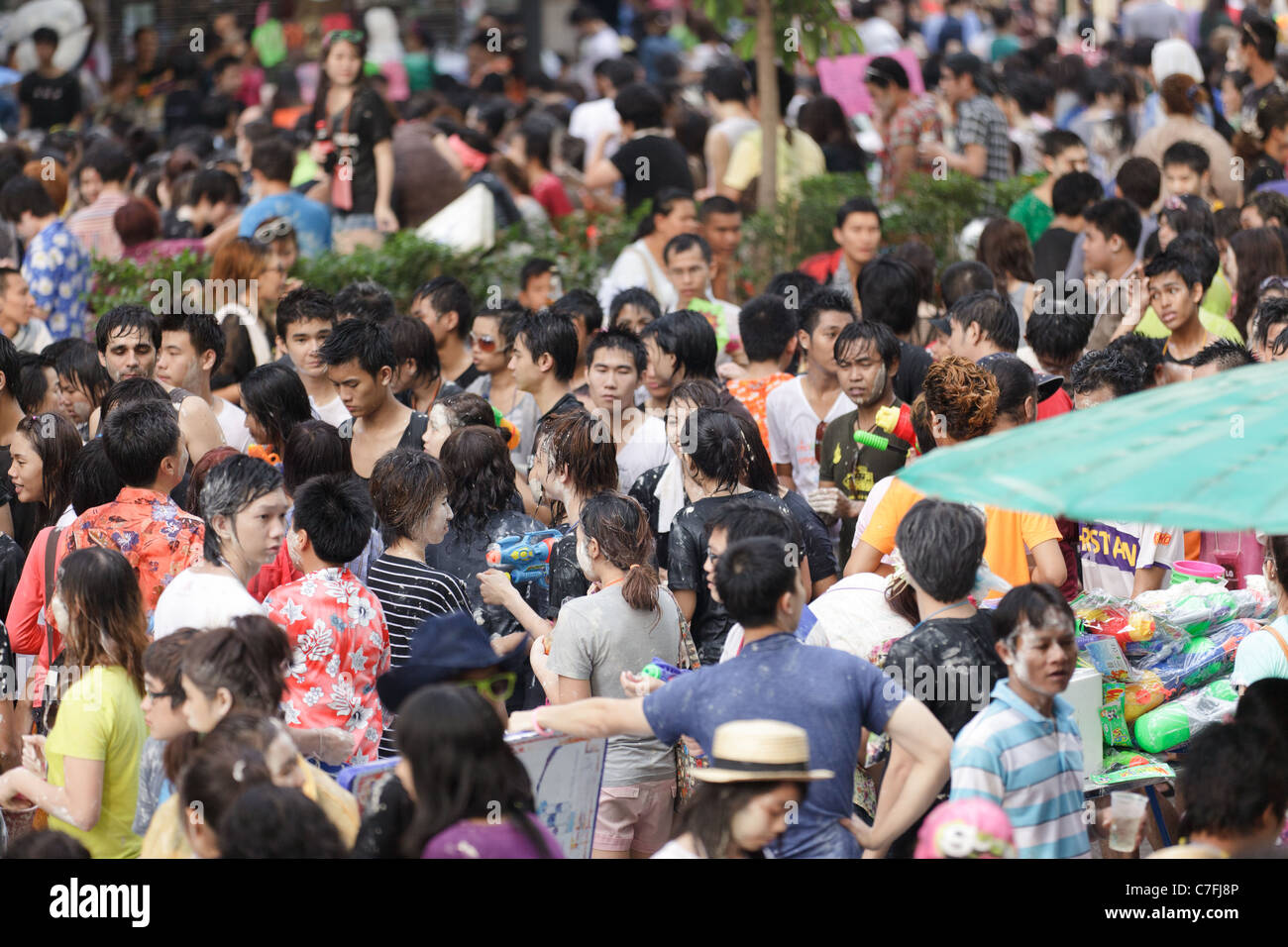 Thai people crowd celebrating song kran buddhist new year in silom road ...