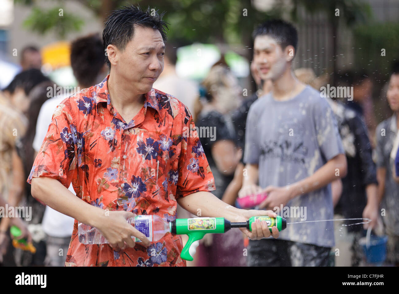 Thai people crowd celebrating song kran buddhist new year in silom road ...
