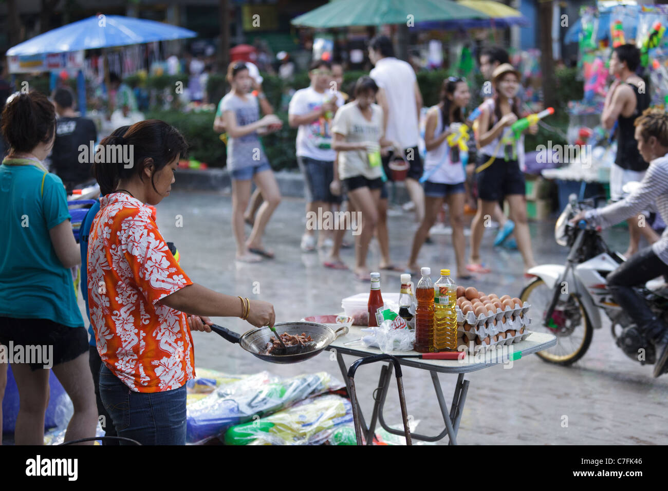 Thai people crowd celebrating song kran buddhist new year in silom road ...