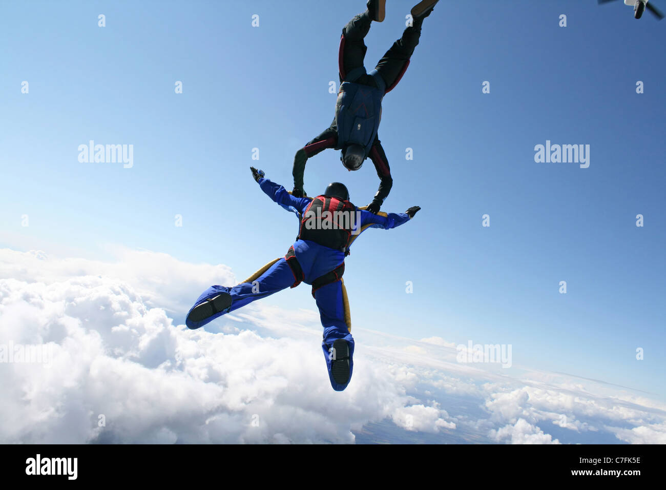 Two skydivers jump from an airplane Stock Photo - Alamy
