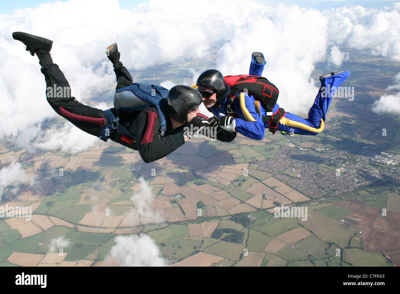 Two skydivers doing formations Stock Photo - Alamy