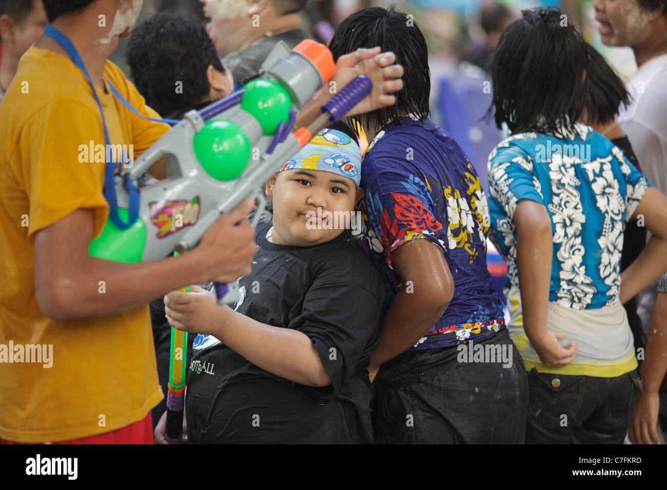 Thai people crowd celebrating song kran buddhist new year in silom road ...