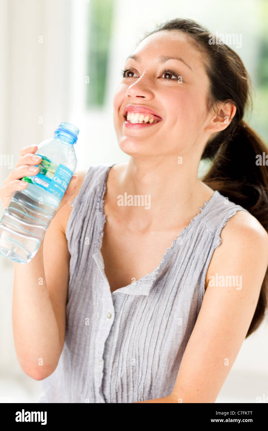 Girl with bottled water Stock Photo - Alamy