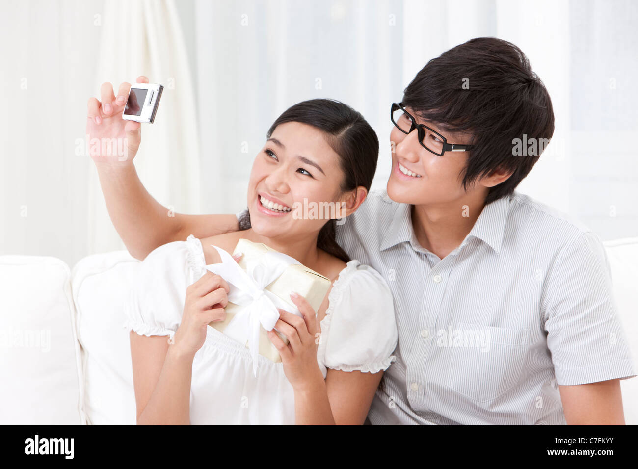 Young Couple Capturing Memories Stock Photo - Alamy