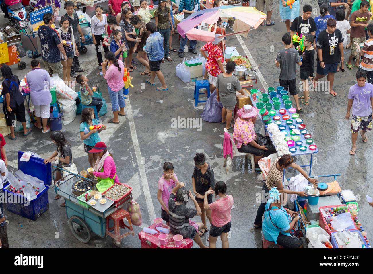 Thai people crowd celebrating song kran buddhist new year in silom road ...