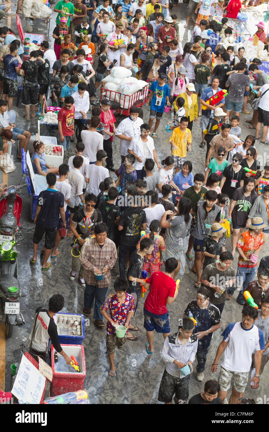 Thai people crowd celebrating song kran buddhist new year in silom road ...