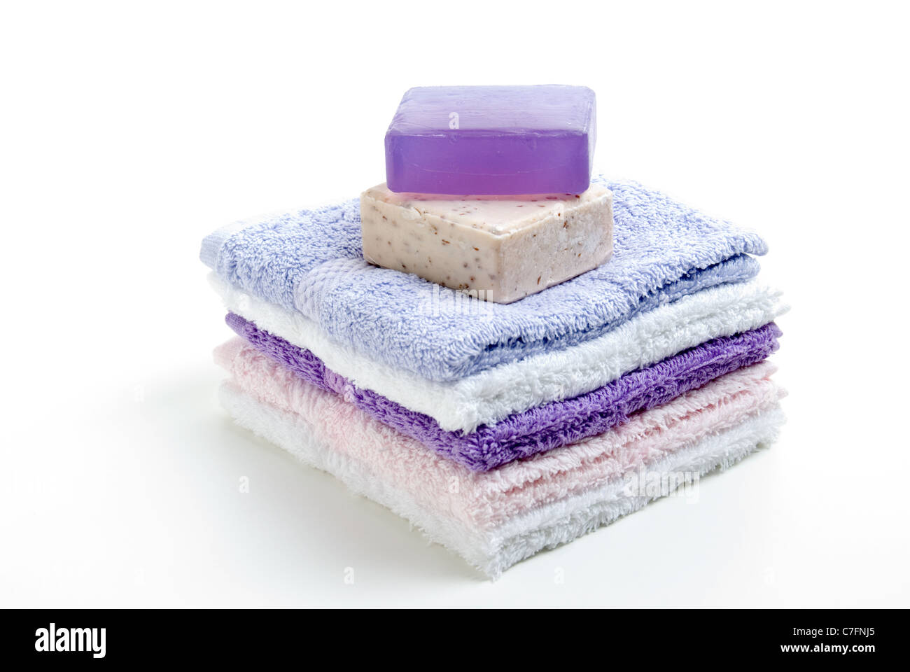 Pile of bath flannels with soap bars Stock Photo - Alamy
