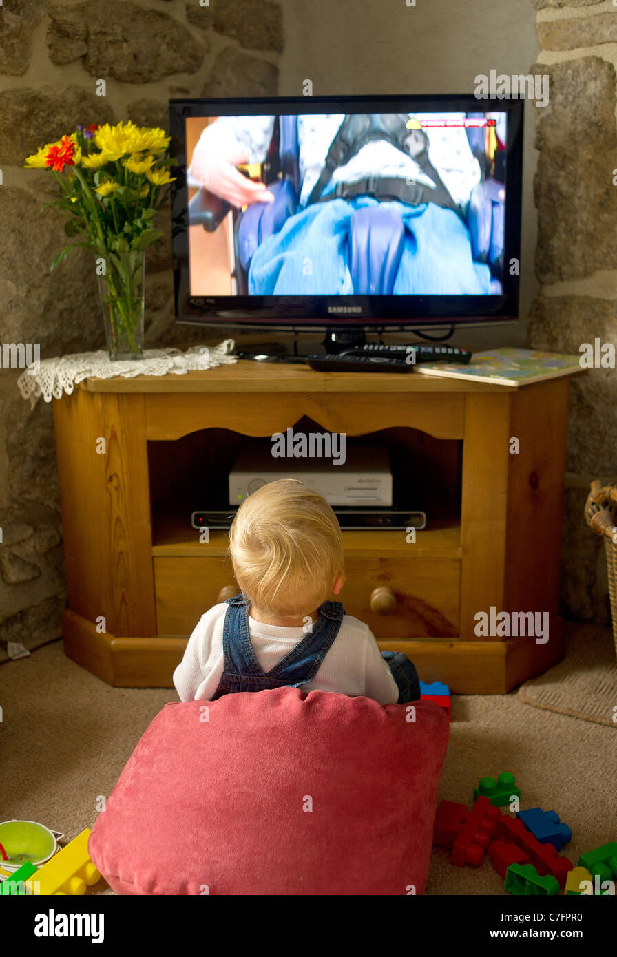 A toddler watching television Stock Photo - Alamy