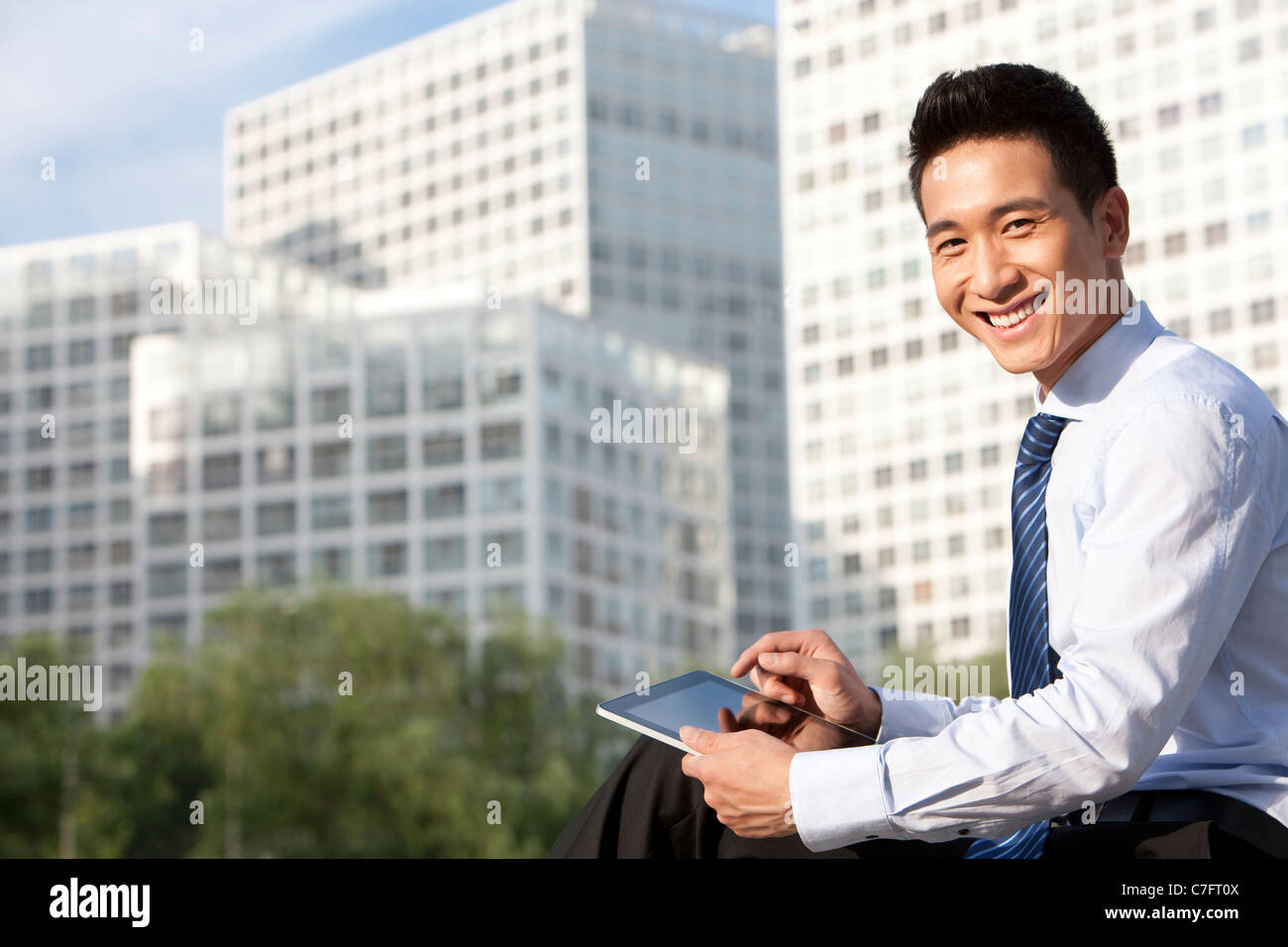 Businessman Using a Tablet Stock Photo - Alamy