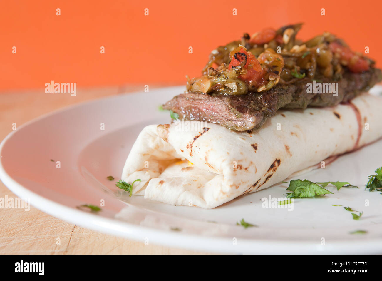Burrito cooked Venezuelan style smothered with marinated skirt steak ...