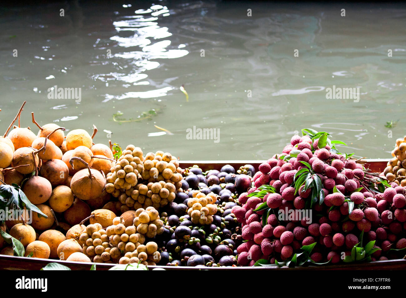 A boat loaded with fresh fruits at the Dameon Saduk floating market ...
