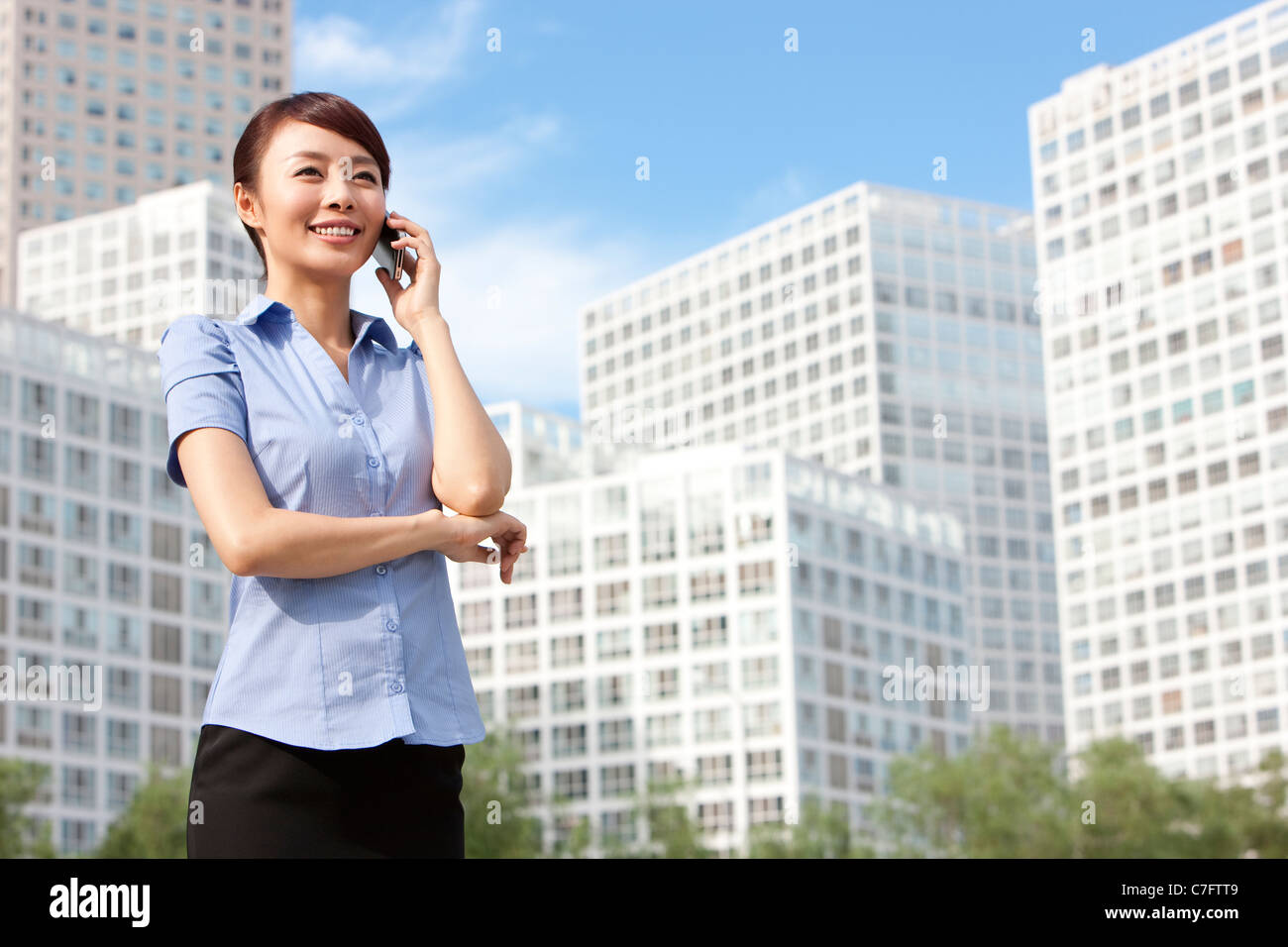 Businesswoman Using Mobile Phone Stock Photo - Alamy
