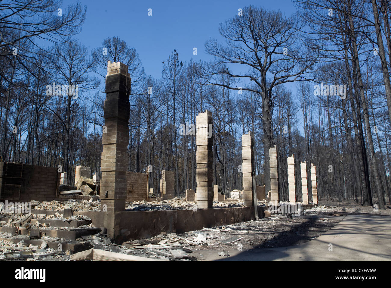 Brick columns are all that remain of a house destroyed by wildfire that ...