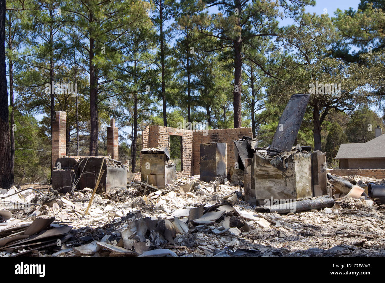 Brick walls are all that remain of a house destroyed by wildfire that ...