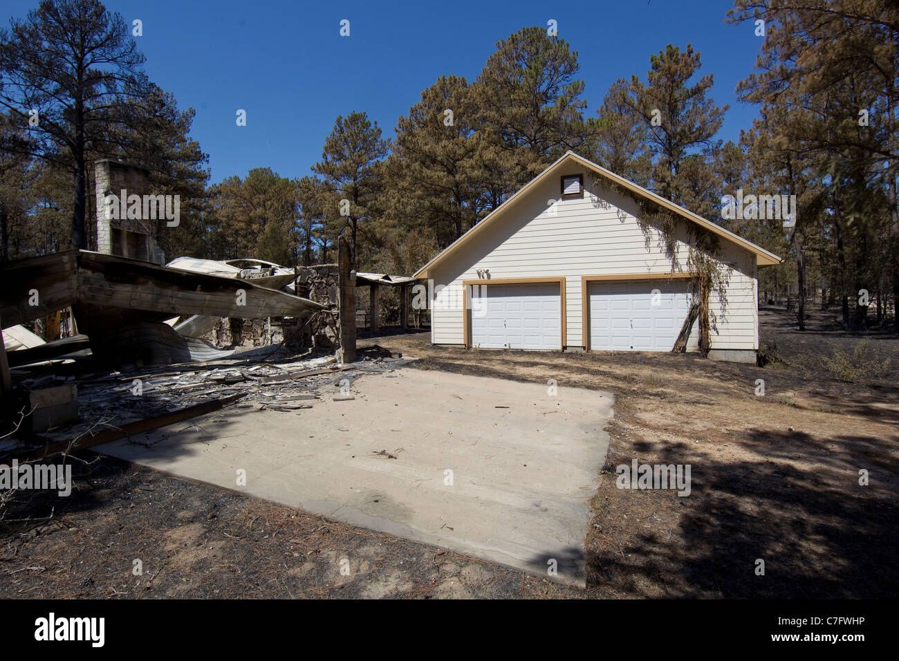 Garage sits untouched while the house next to it burned to the ground ...
