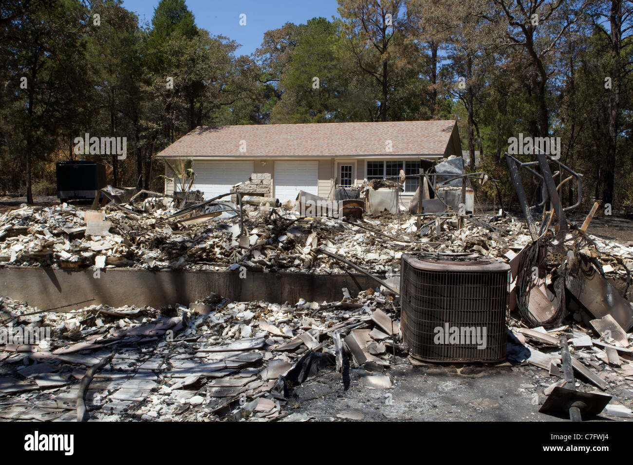 Garage sits untouched while the house next to it burned to the ground ...