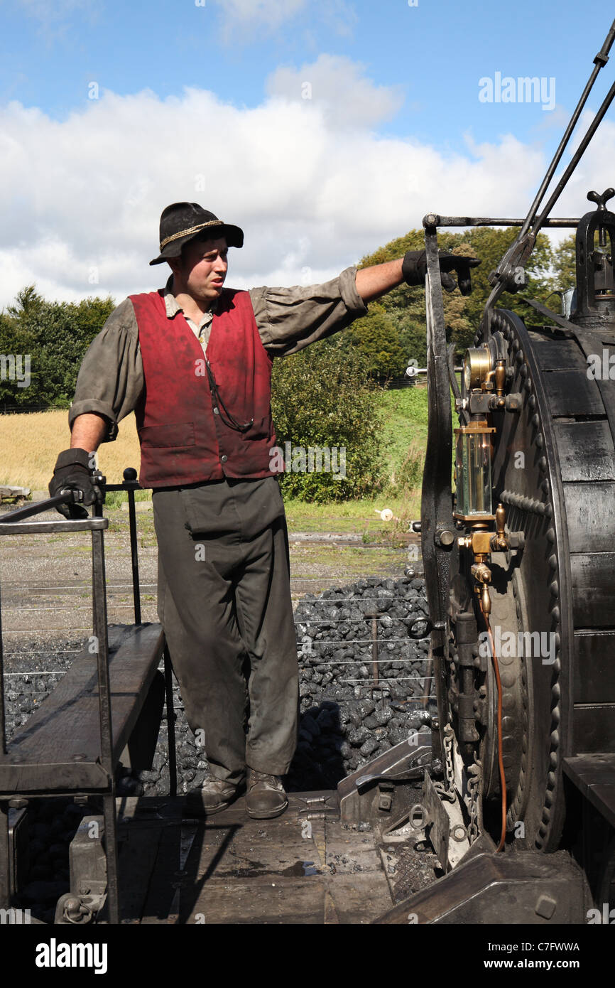 The driver of replica steam locomotive Steam Elephant in period costume ...