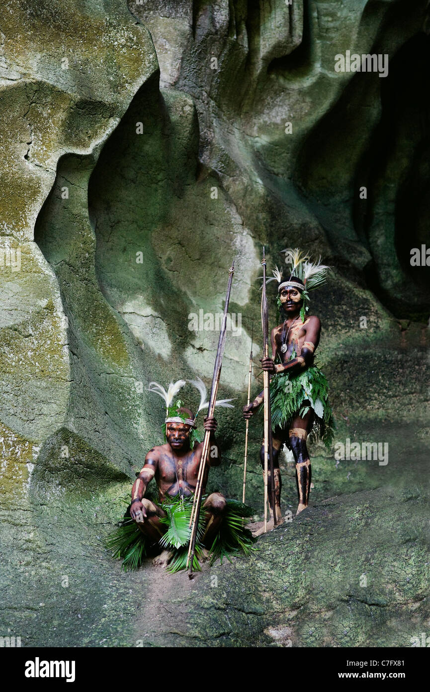 Two warriors of a Papuan tribe of Yafi in traditional clothes ...