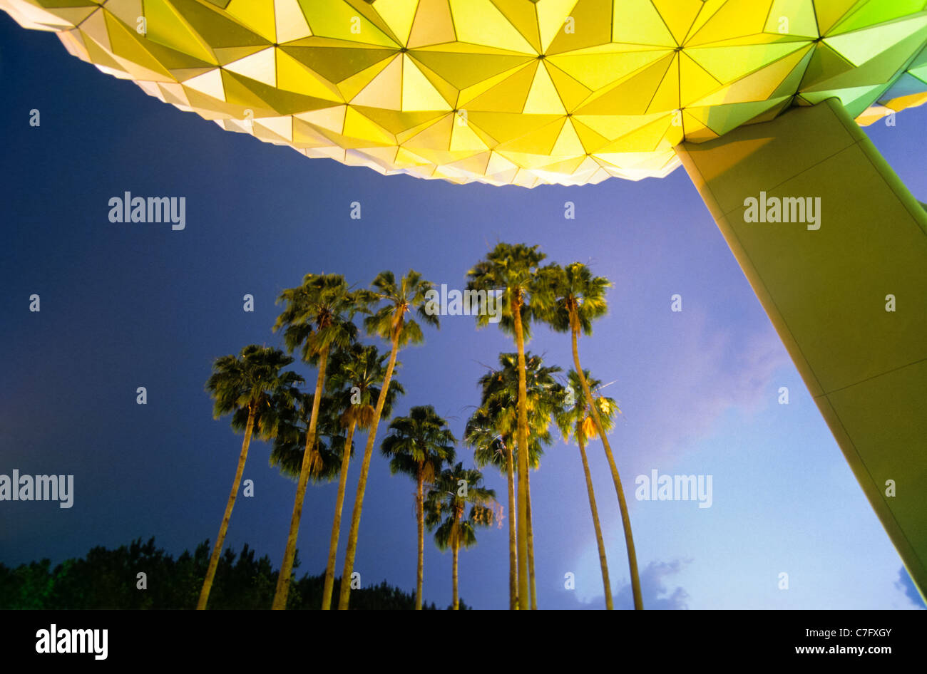 Palm trees under Space Ship Earth structure at Epcot center in Florida ...